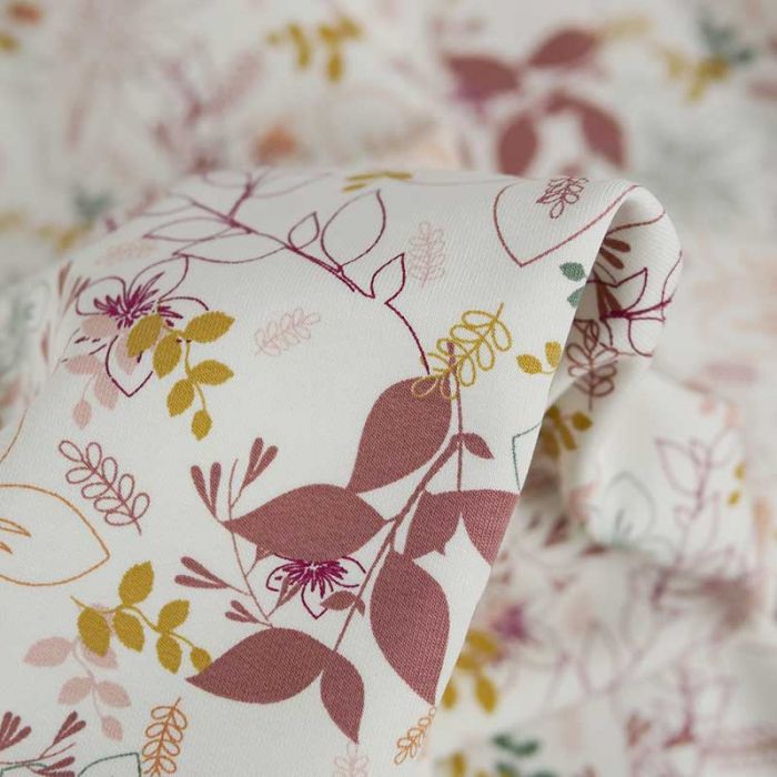 Tissu jersey fin couronnes dorées - blanc